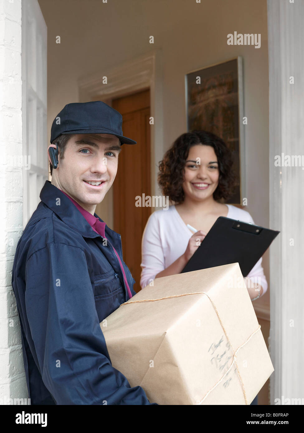 Delivery man parcel bringing hi-res stock photography and images - Alamy