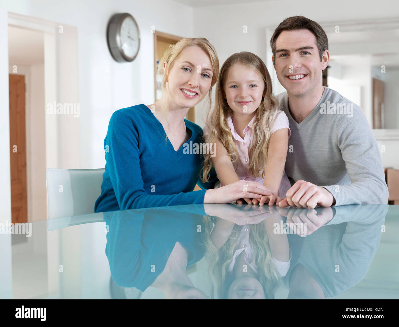 Portrait of family at kitchen table Stock Photo - Alamy