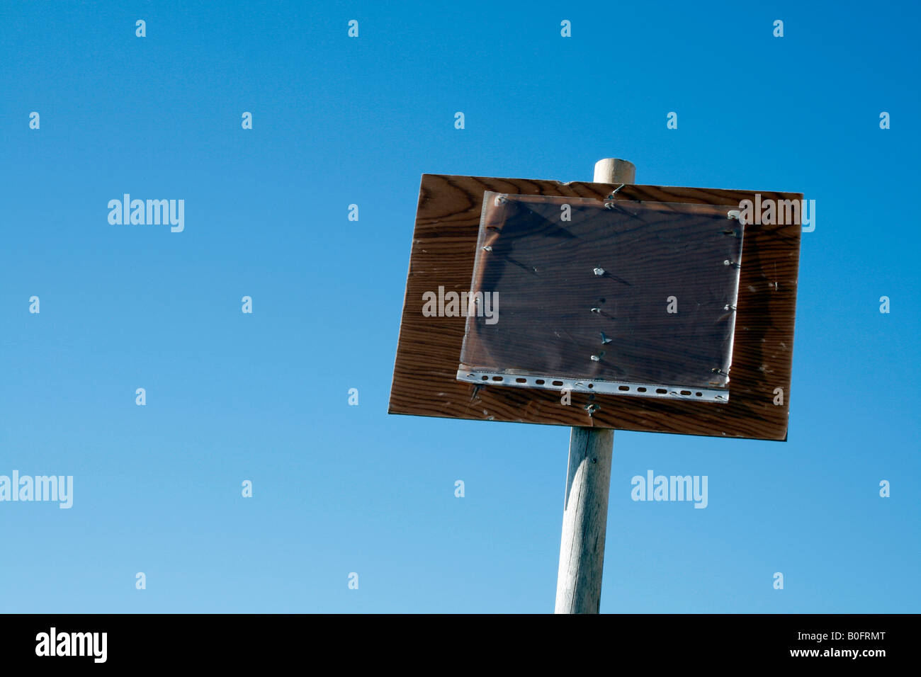 plastic document sleeve on empty sign post Stock Photo - Alamy