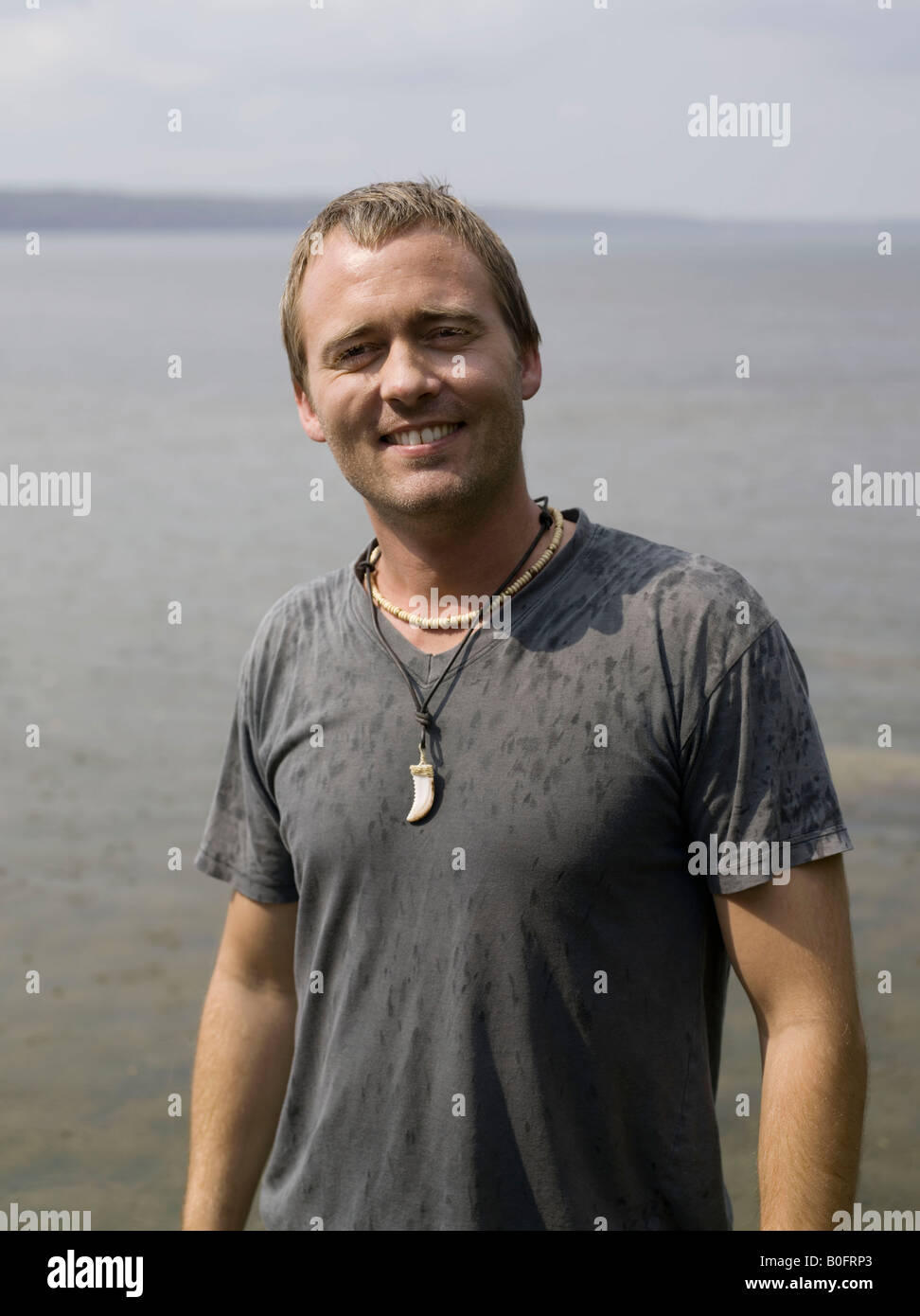 Man smiling into camera Stock Photo - Alamy
