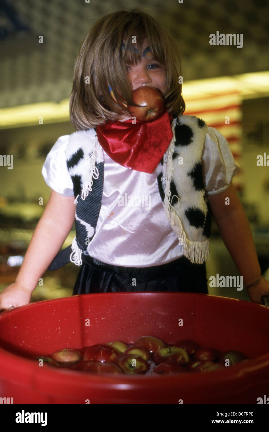Young girl,apple in mouth,apple bobbing,halloween,Martha's Vineyard ...