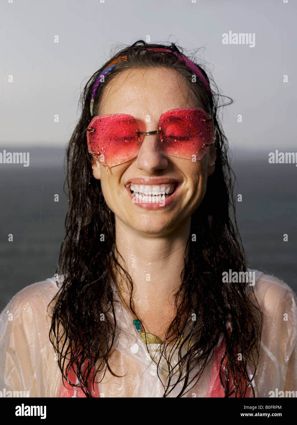 Woman standing in the rain Stock Photo - Alamy