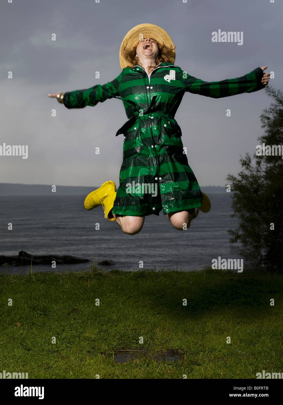 Woman jumping up in the air screaming Stock Photo - Alamy
