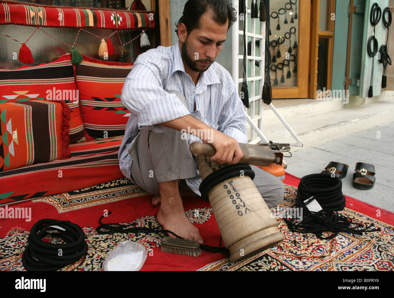 Man making agals in Doha, Qatar Stock Photo - Alamy