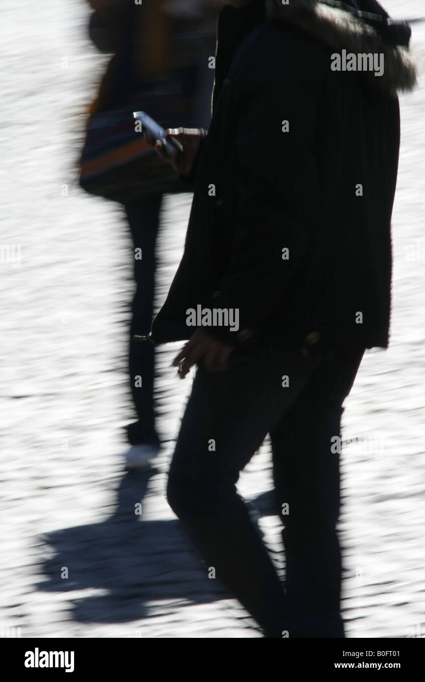 person with mobile phone running fast in town Stock Photo - Alamy