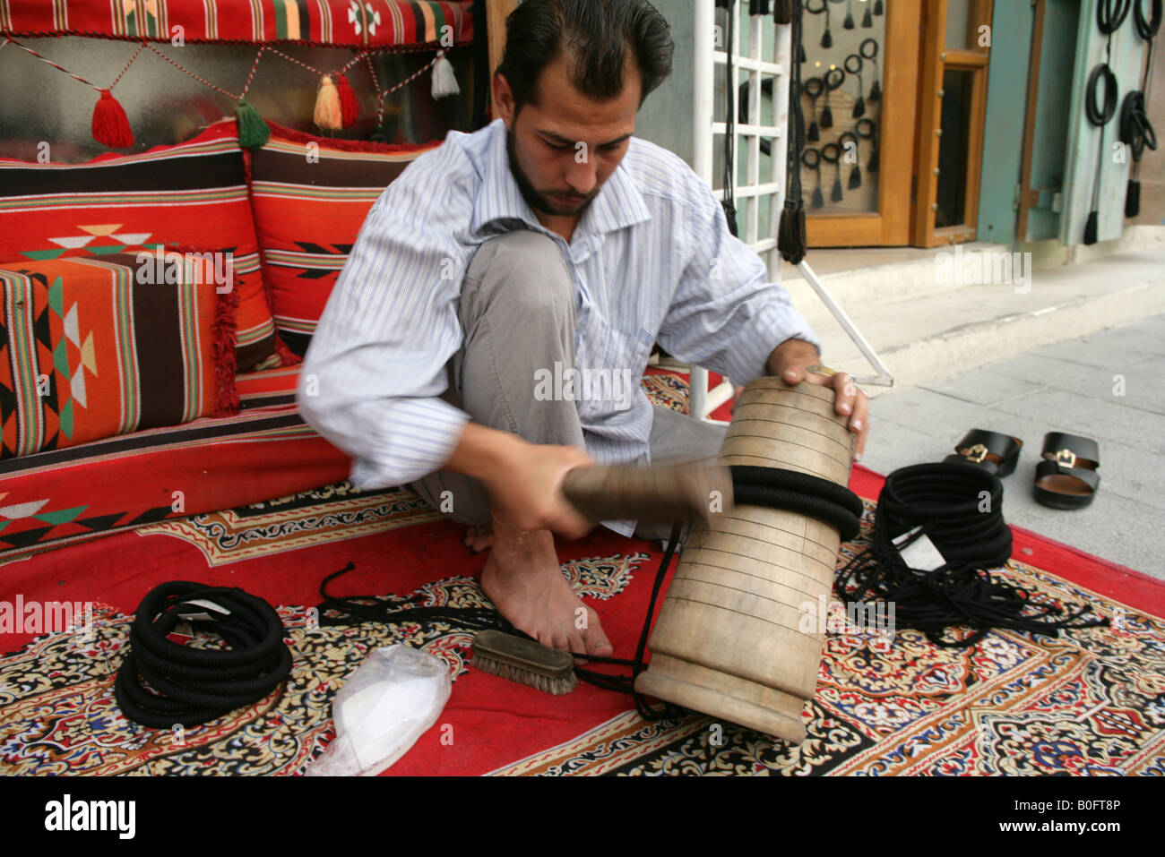 Man making agals in Doha, Qatar Stock Photo - Alamy