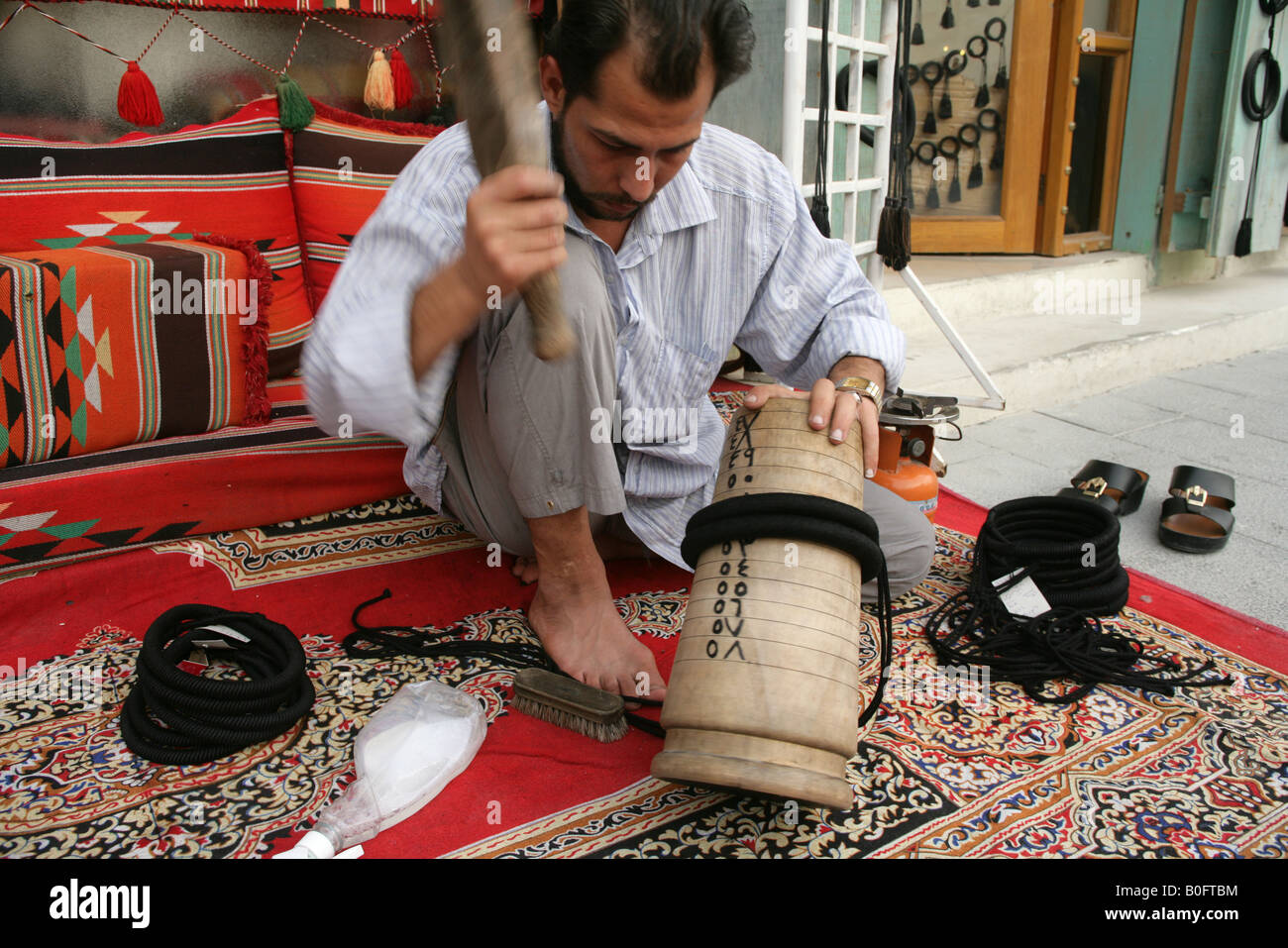 Man making agals in Doha, Qatar Stock Photo - Alamy