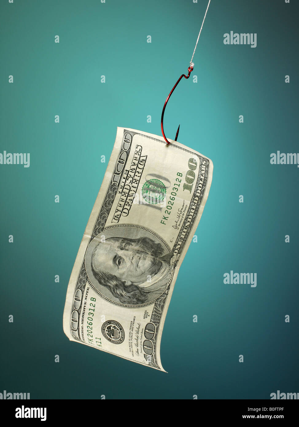 U.S. hundred dollar bill on hook as if a lure Stock Photo - Alamy