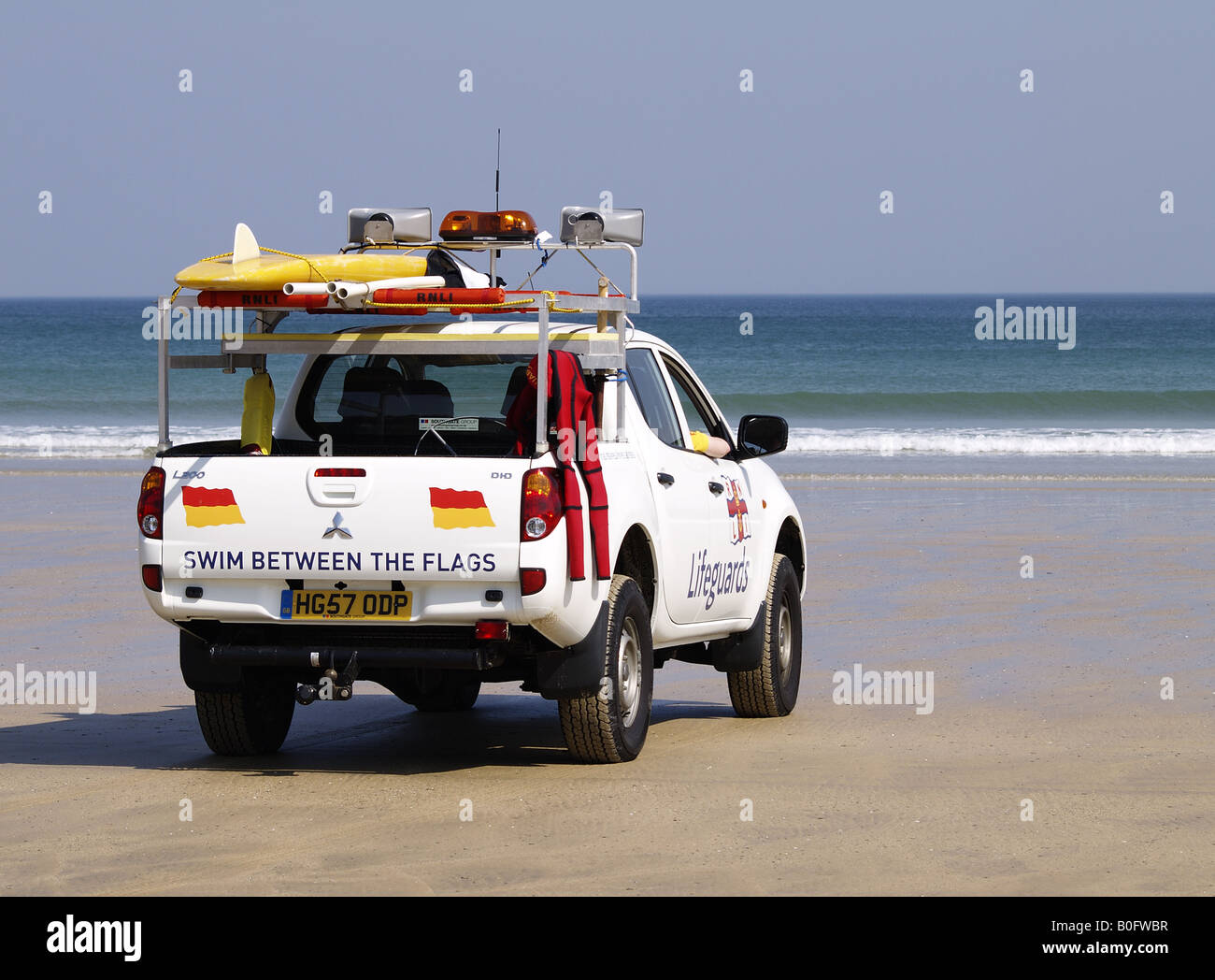 Lifeguard in vehicle watching an empty sea Stock Photo - Alamy