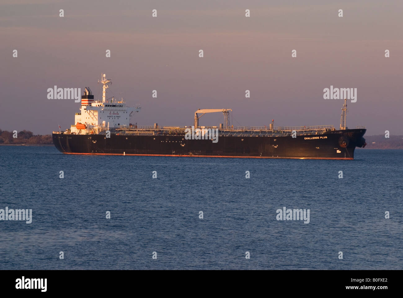 A merchant vessel anchored in the ocean water between Jamestown and ...