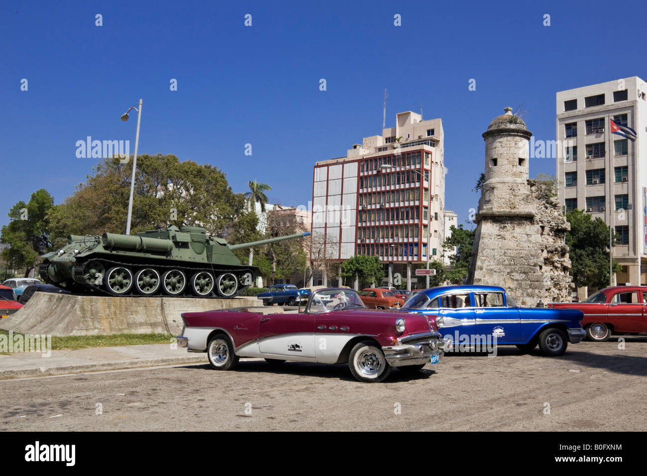 Old american cars and russian tank SAU-100. Museum of Revolution ...