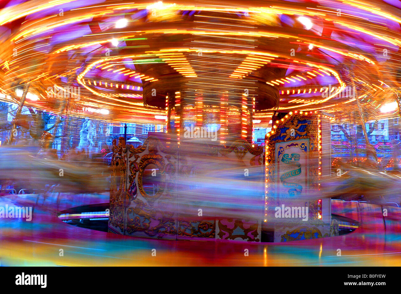 Spinning Carousel at night Stock Photo - Alamy