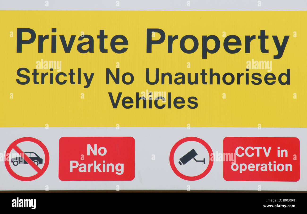 Yellow private property strictly no unauthorised vehicles sign Stock ...