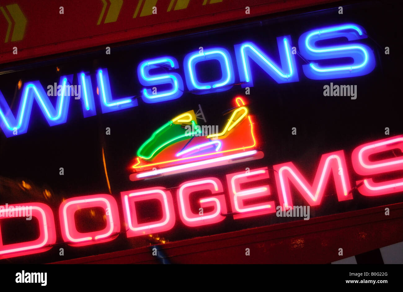 Neon sign advertising dodgem cars at an amusement park Stock Photo - Alamy