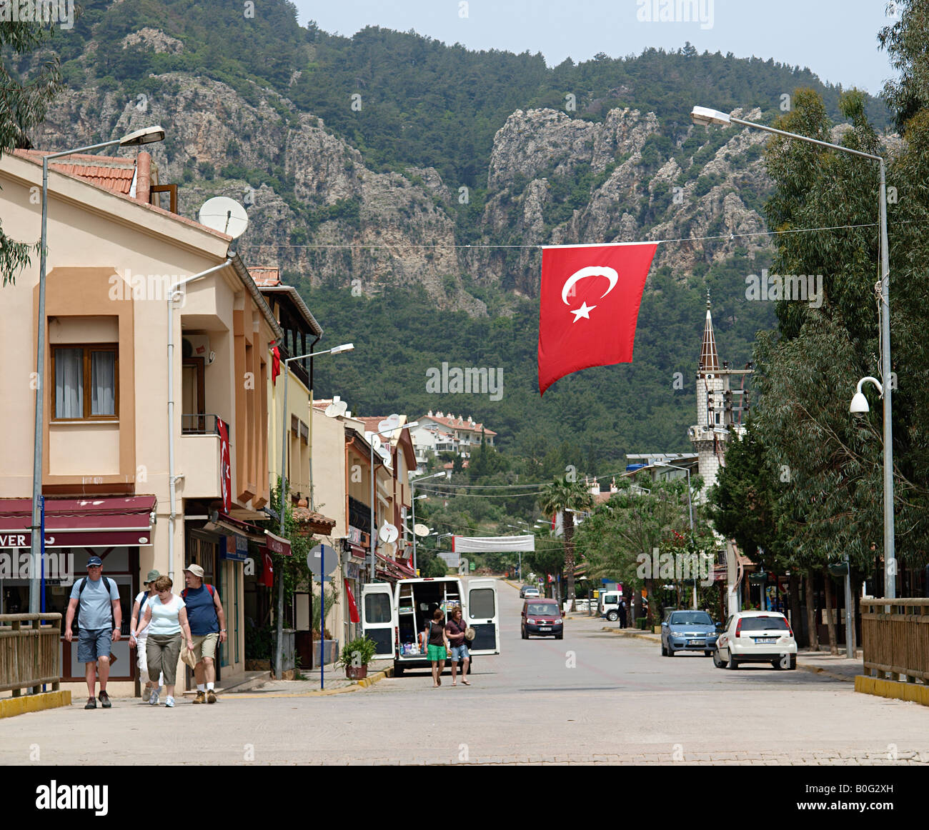 MAIN STREET TURUNC WITH TURKISH FLAG AND MOSQUE, , MUGLA TURKEY Stock ...