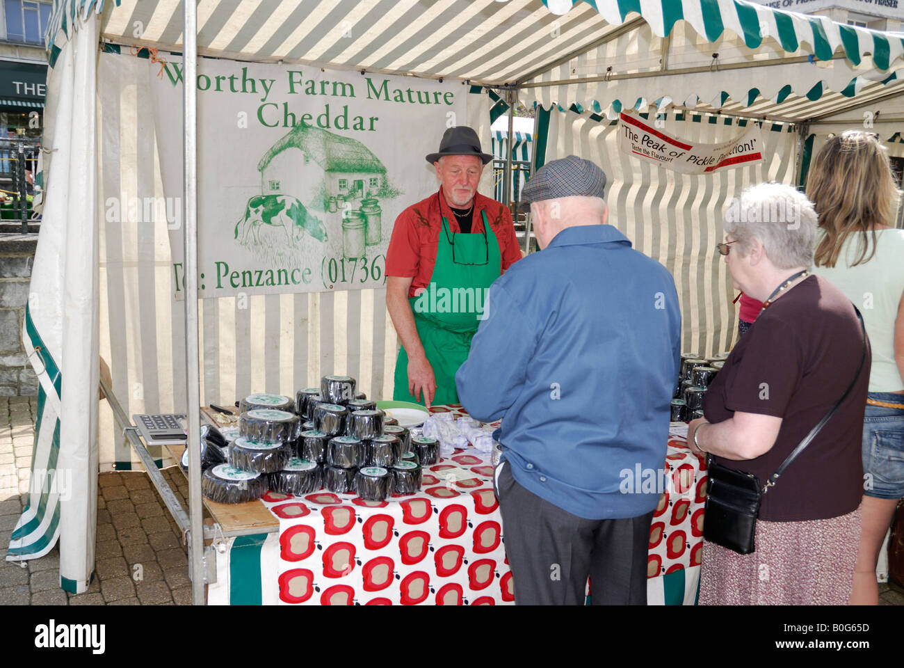 People buying cheese from a farmers market in Plymouth, Devon, UK Stock ...