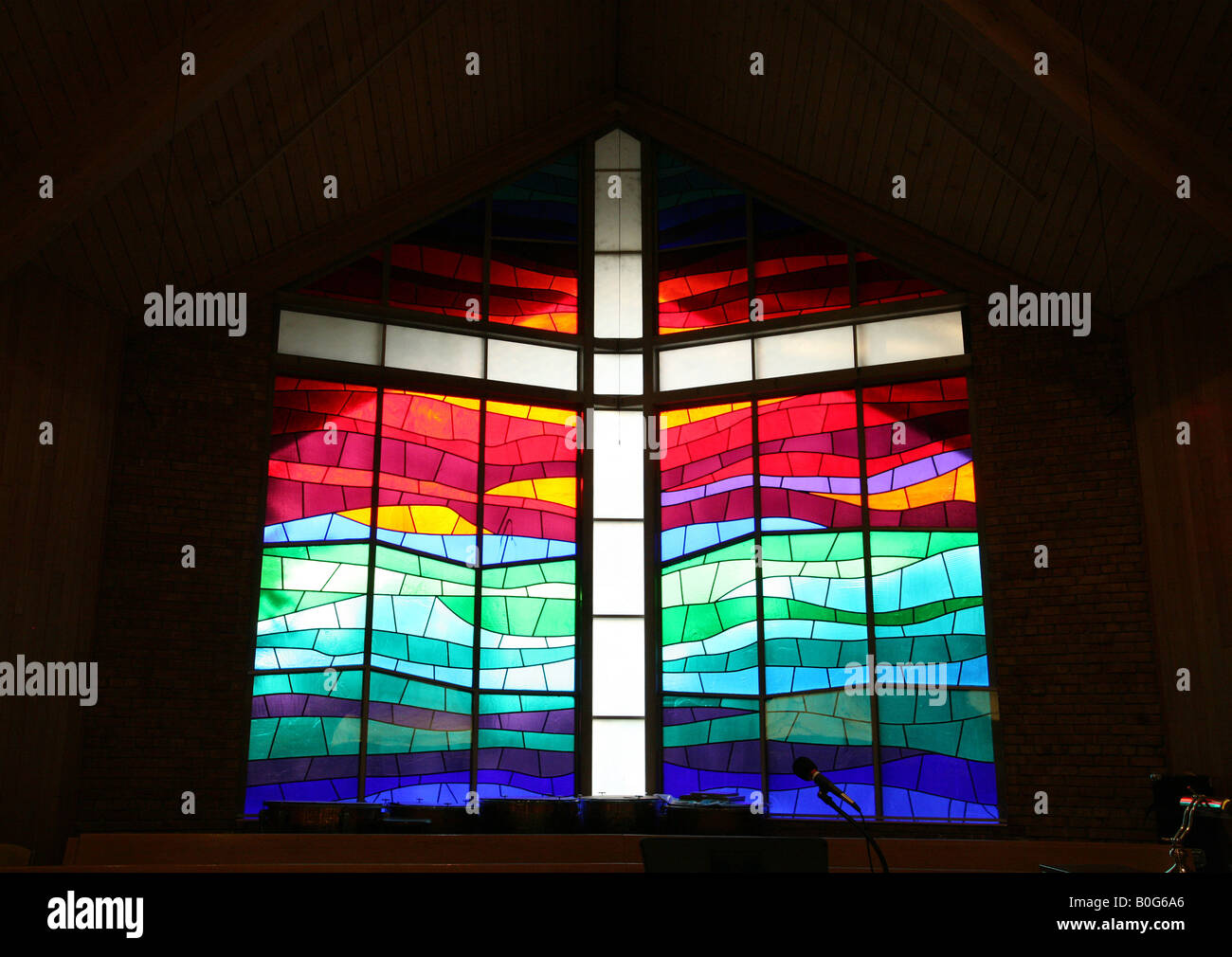 colorful stained glass window with a Christian cross Stock Photo - Alamy