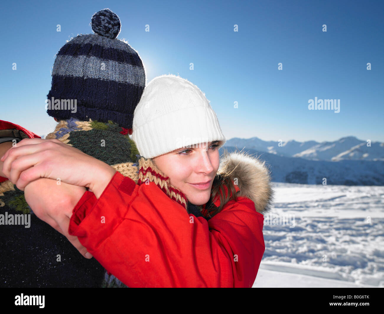 Couple hugging on mountain top Stock Photo - Alamy