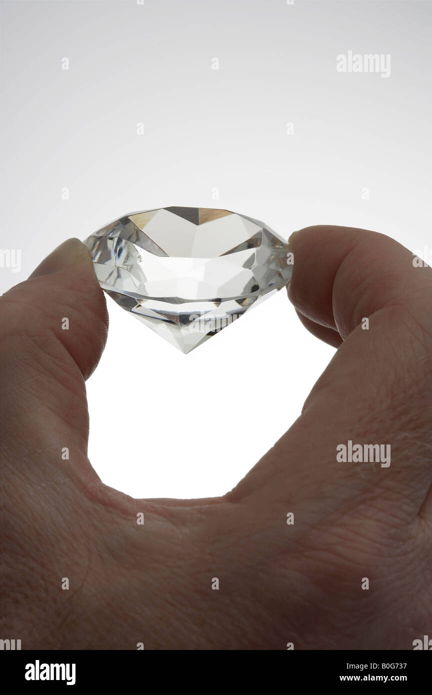large diamond held in fingers Stock Photo - Alamy