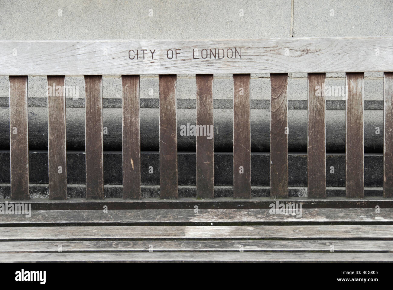 Close up of wooden bench engraved with the wording City of London Stock ...