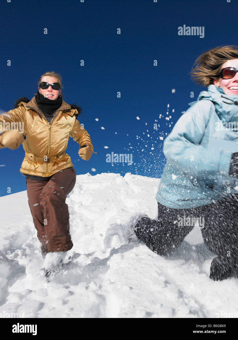 Young woman running in snowy area hi-res stock photography and images ...