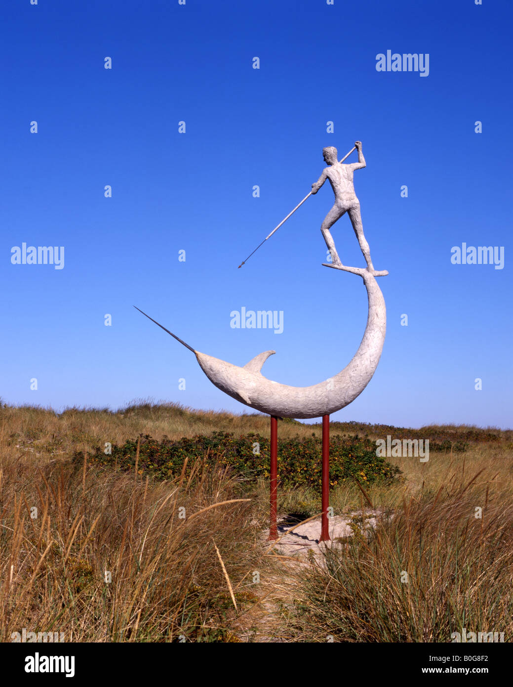 Sculpture of a man harpooning a whale under a blue sky,Martha's ...