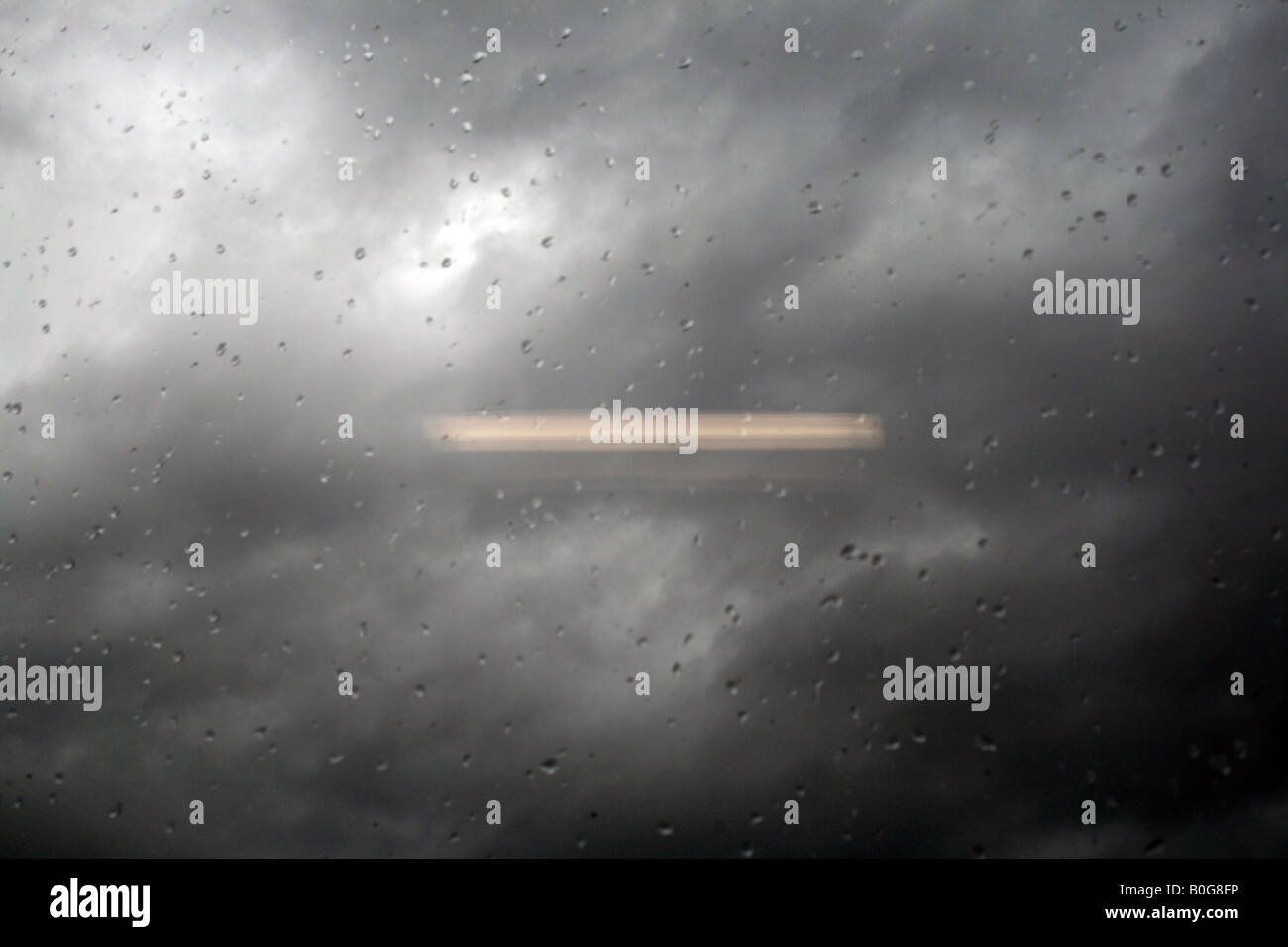 light bulb reflection on window with rain drops Stock Photo - Alamy