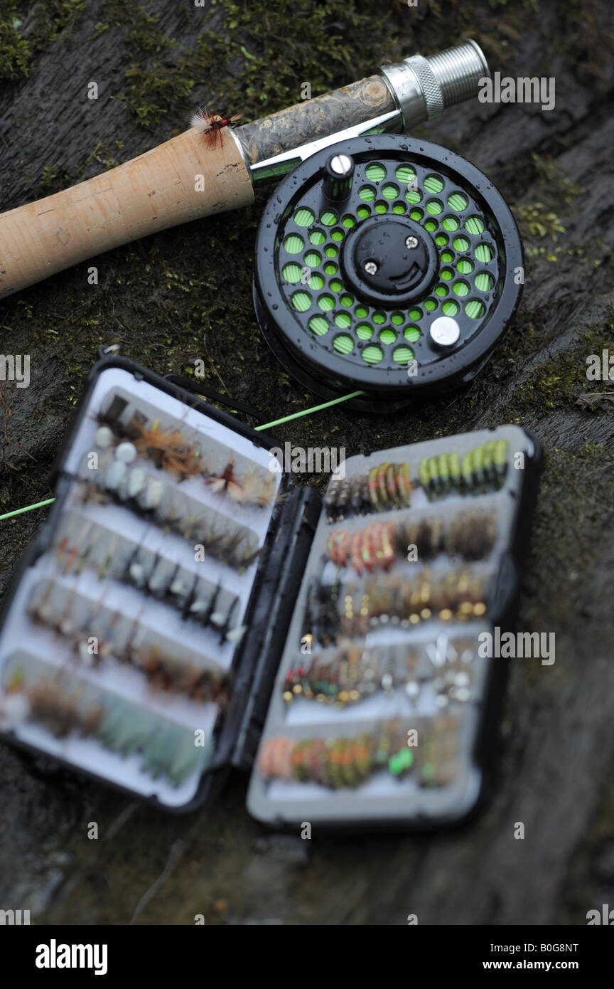 A fly fishing set of tackle, with rod, reel and a box of assorted flies ...