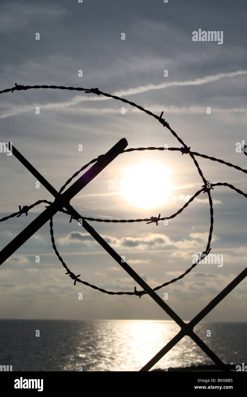 barbed wire defence barrier outdoors by sea Stock Photo - Alamy
