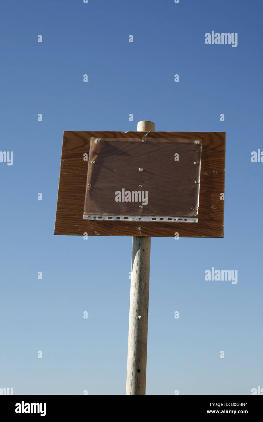 plastic document sleeve on empty sign post Stock Photo - Alamy
