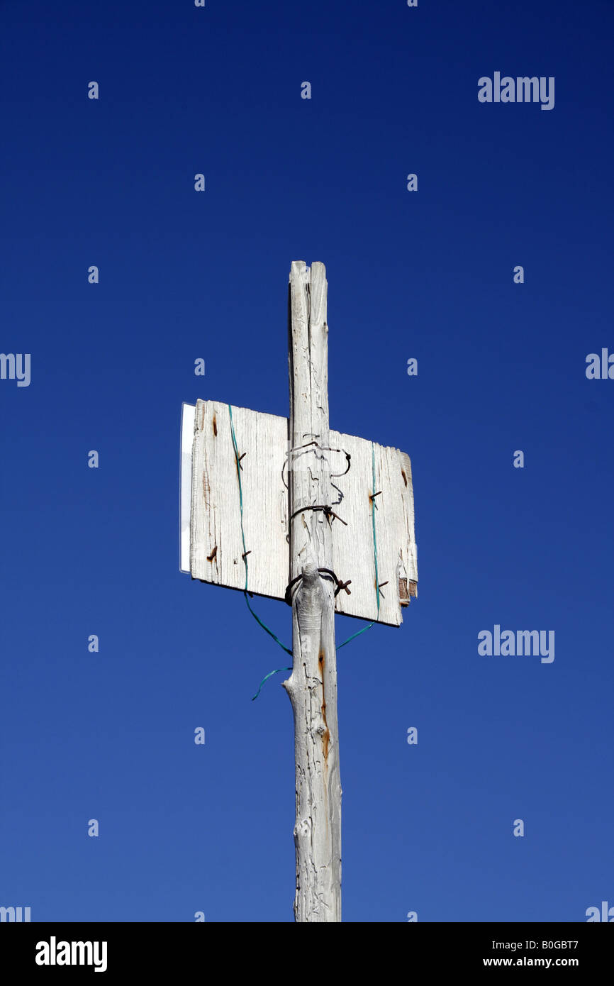 old empty sign post and blue sky Stock Photo - Alamy