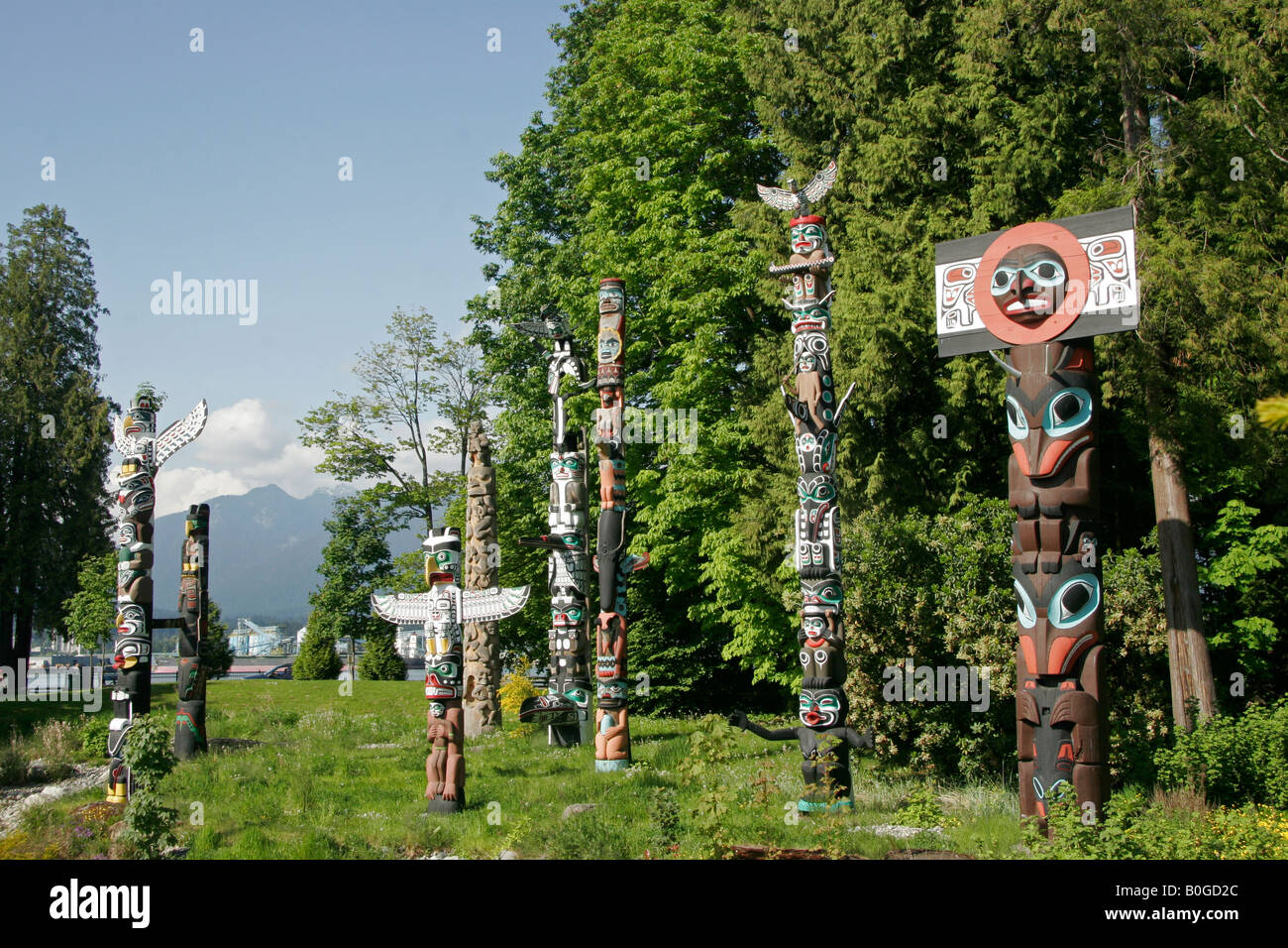 Vancouver line of totems Stock Photo - Alamy