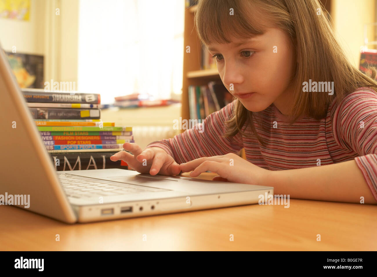Girl on computer Stock Photo - Alamy
