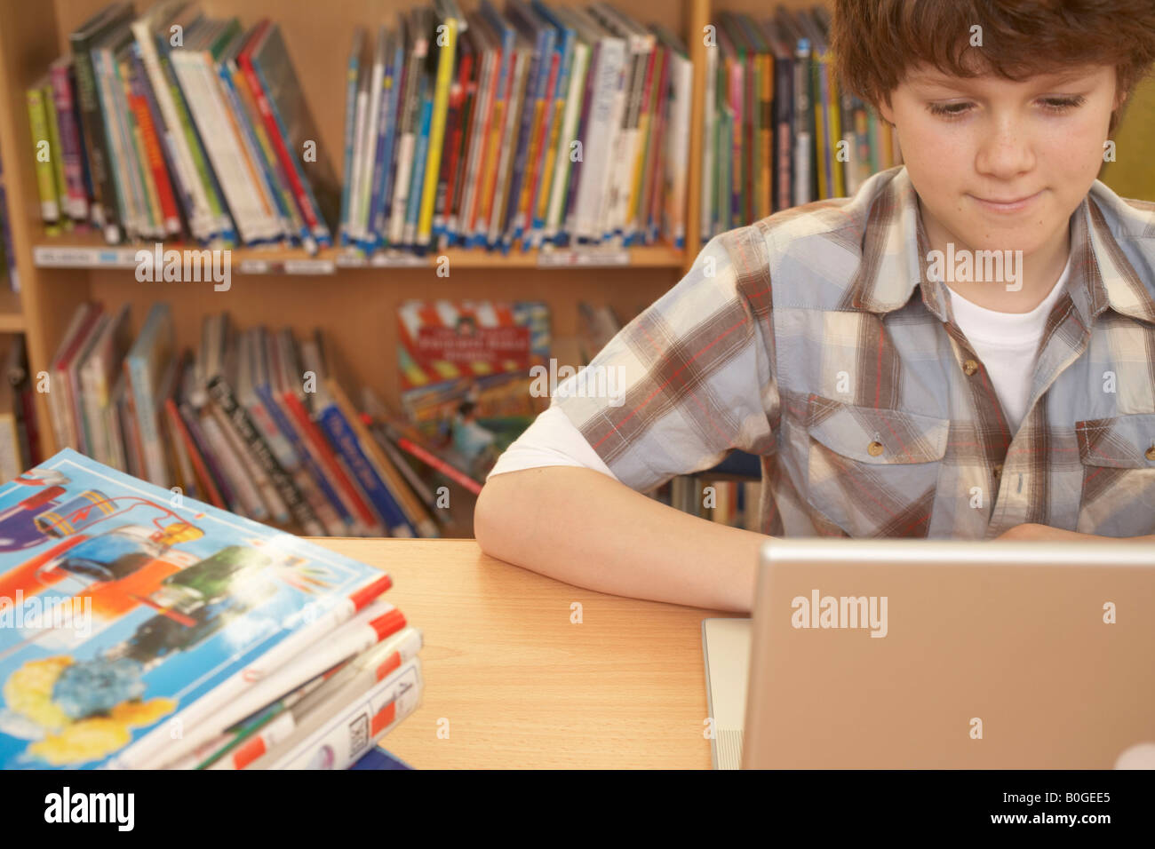 Boy on computer Stock Photo - Alamy