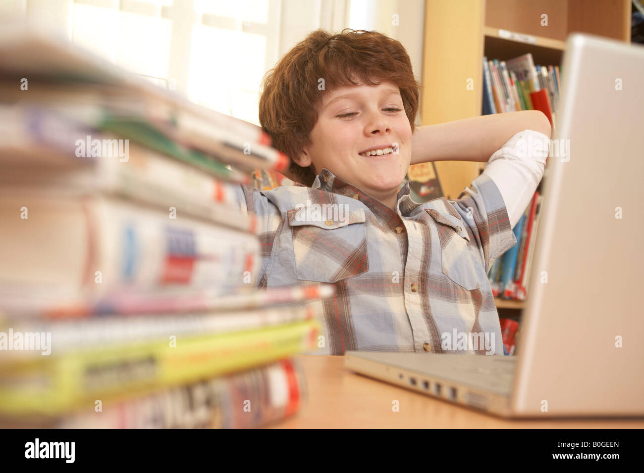 Boy on computer Stock Photo - Alamy