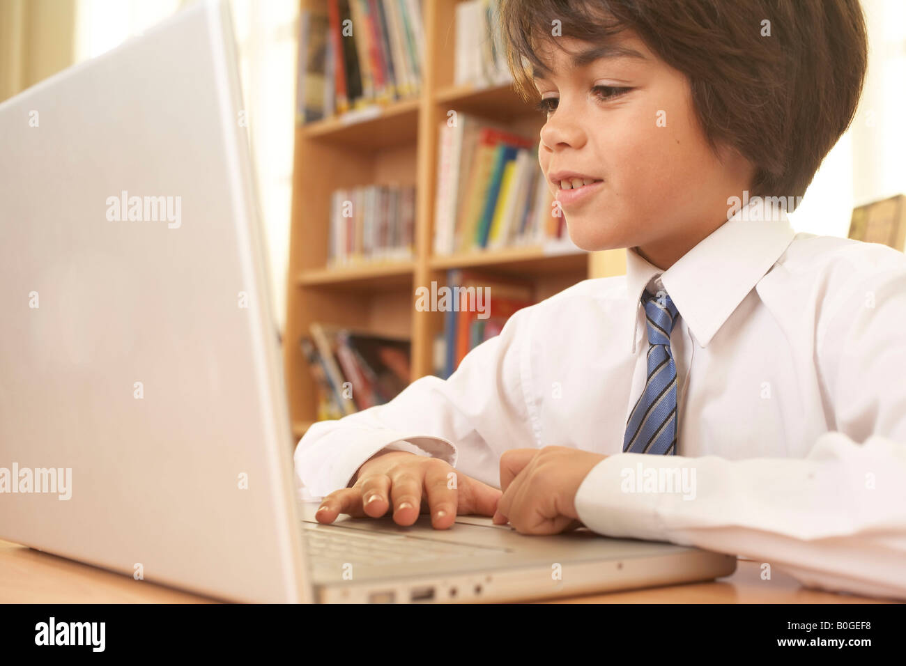 Boy on computer Stock Photo - Alamy