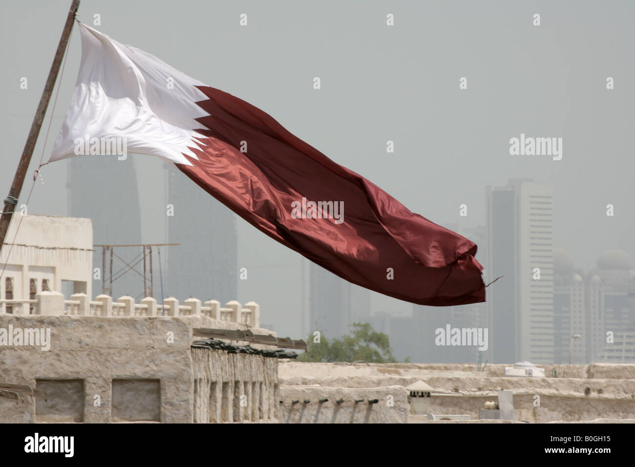 Qatari flag flapping over the Souq Waqif market in Doha, Qatar Stock ...