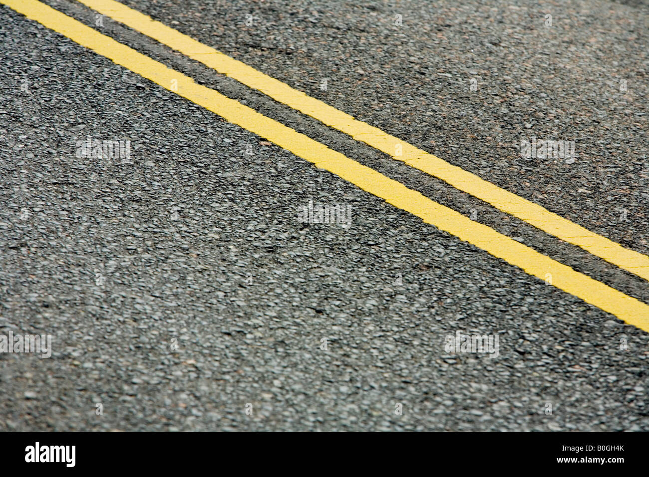 Double yellow lines on asphalt road hi-res stock photography and images ...