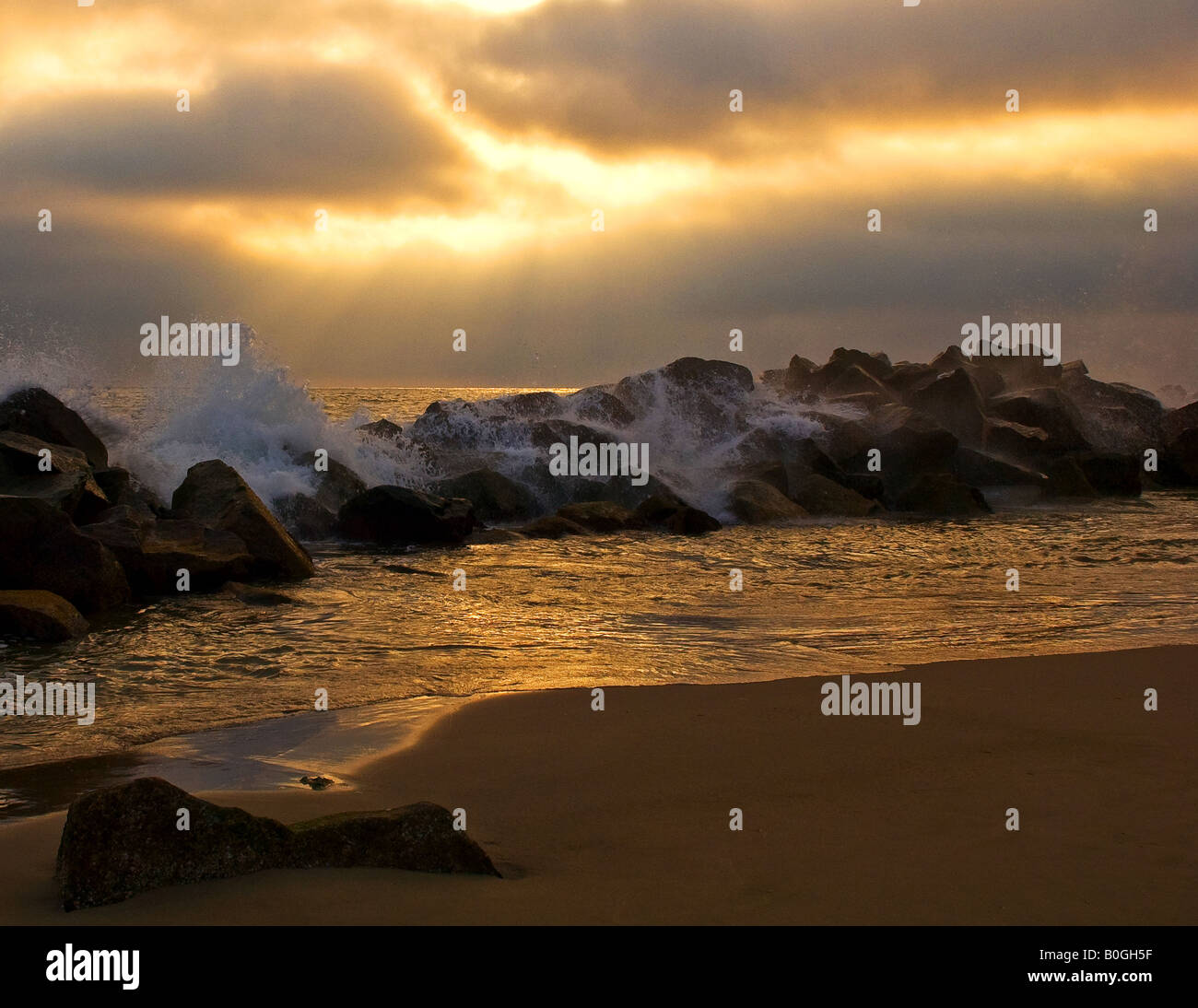 Warm afternoon sunset shining through the stormy clouds, creating a ...