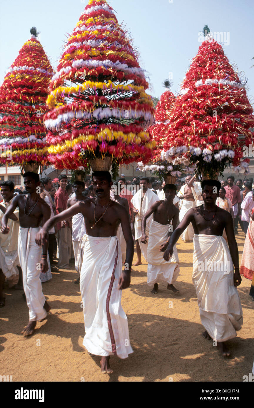 Dancers performing the Kavadiyattam ritual dance, a votive offering to ...