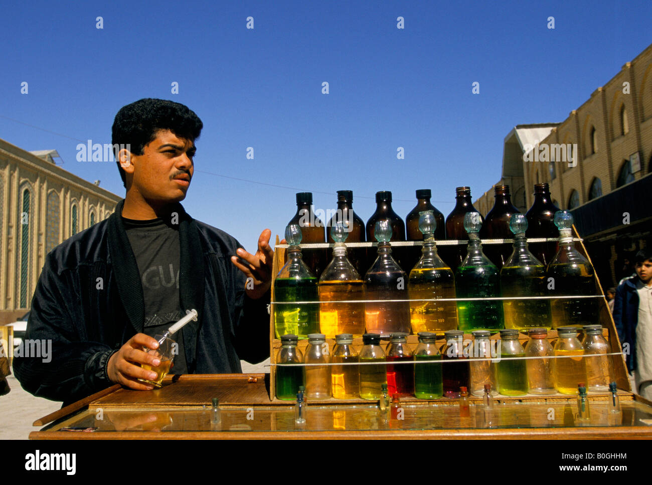 Perfume vendor outside shrine of the Imam Ali, Najaf, Iraq Stock Photo ...