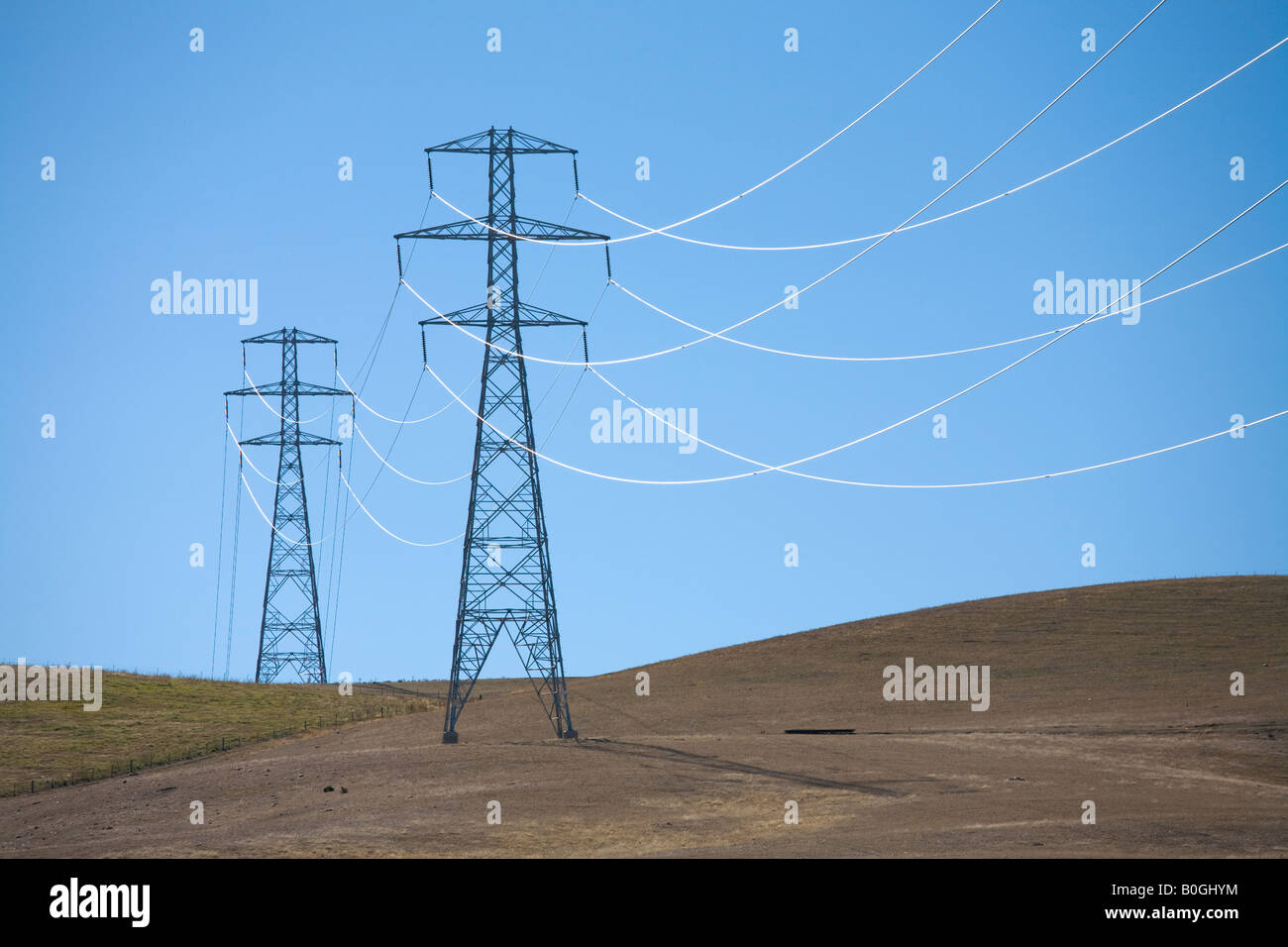 Power pylons carrying electricity throughout the country Stock Photo ...