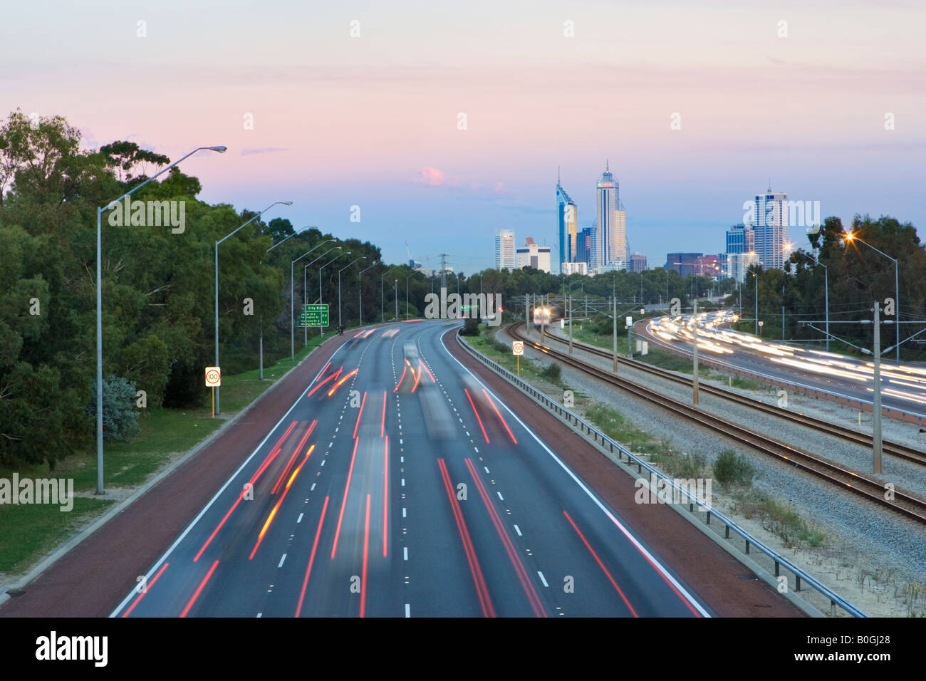 Busy traffic at dusk on the Mitchell Freeway heading towards Perth ...