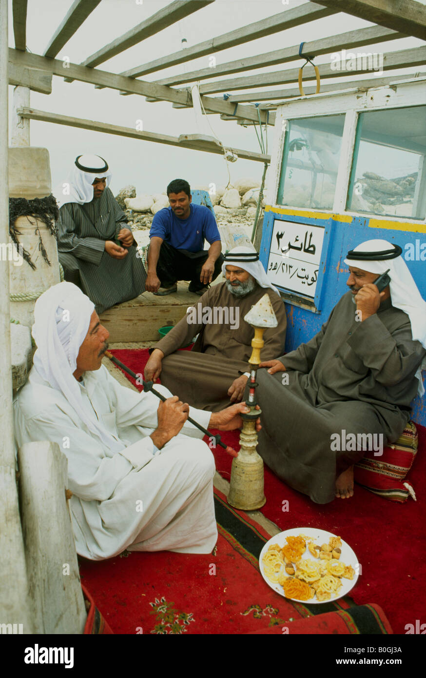 Arab man smoking shisha on hi-res stock photography and images - Alamy