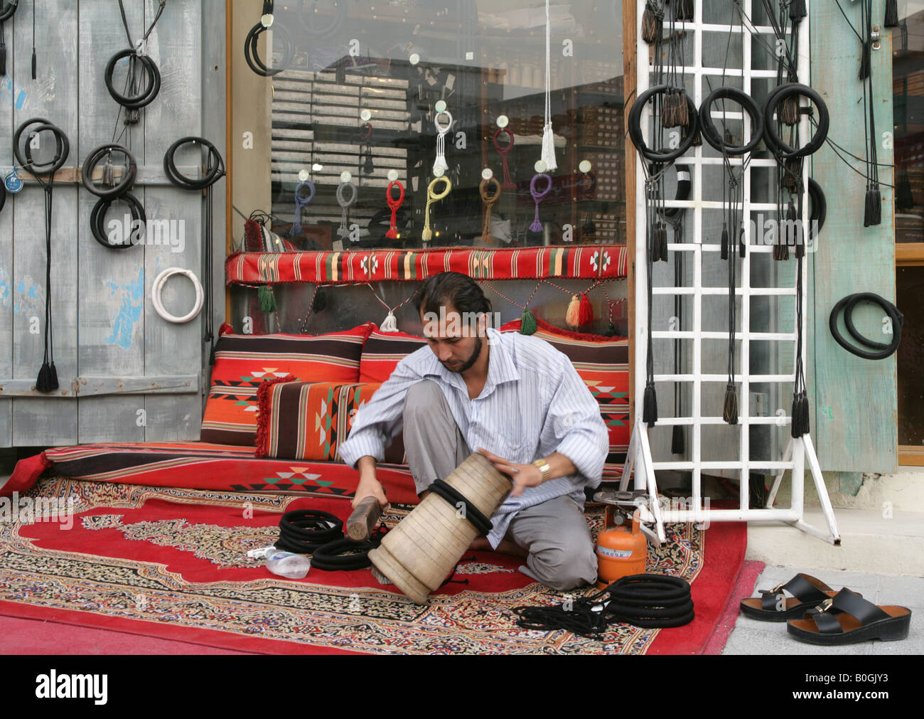 Man making agals in Doha, Qatar Stock Photo - Alamy