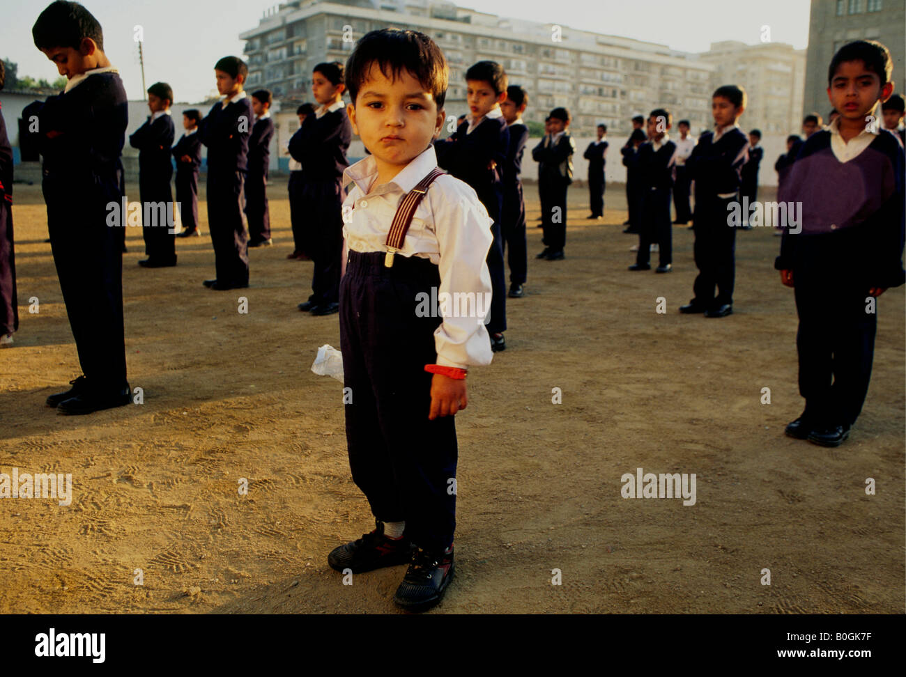 A group of boys standing in the playground of a private school ...