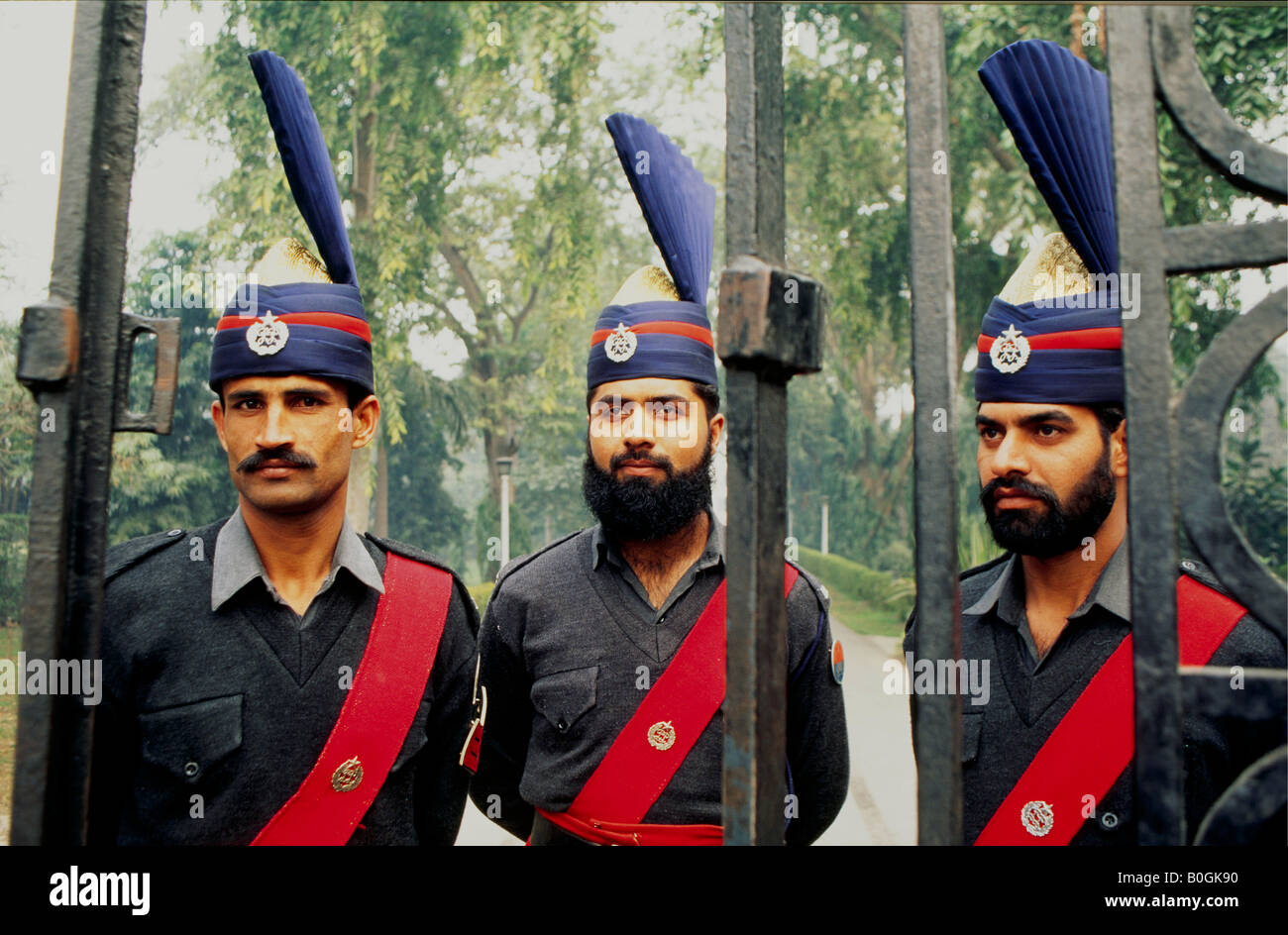 Three guards standing by the gate, outside the Punjab Governor's House ...