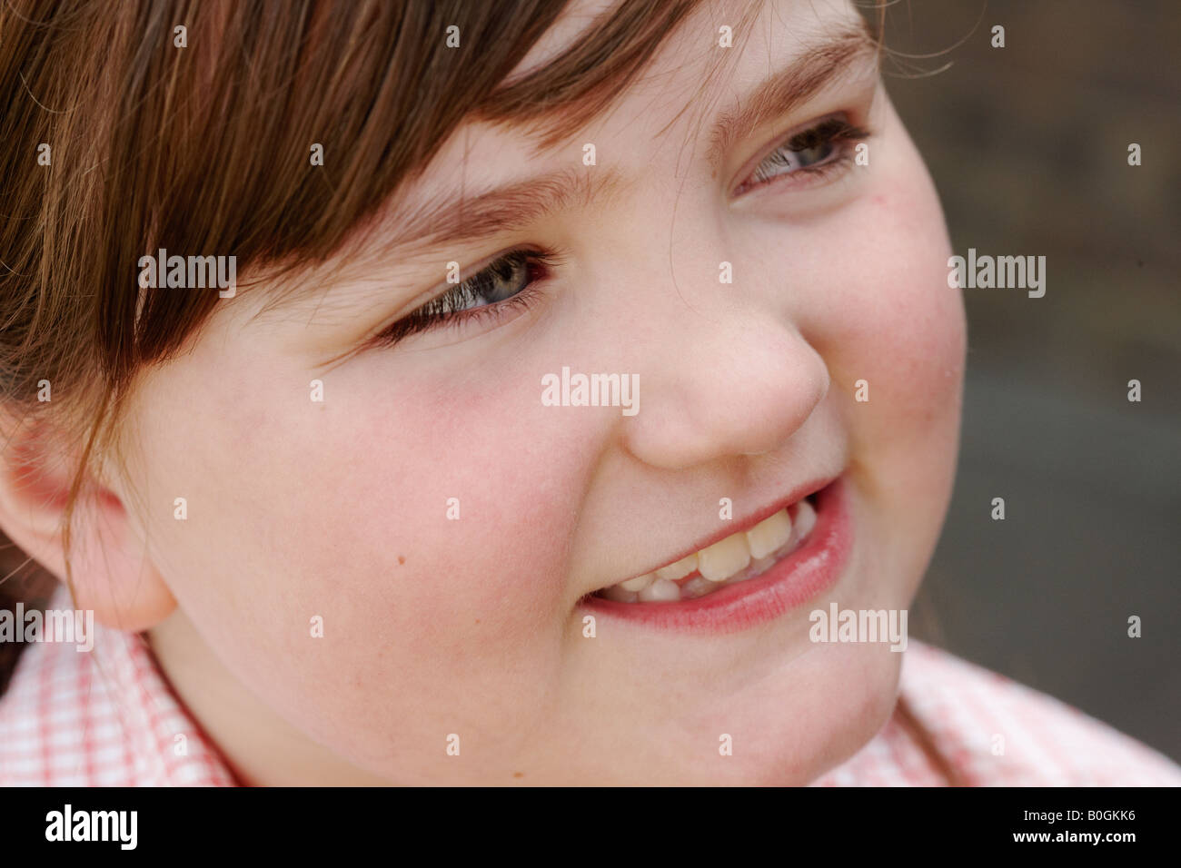 Pretty young student, in uniform, aged seven Stock Photo - Alamy