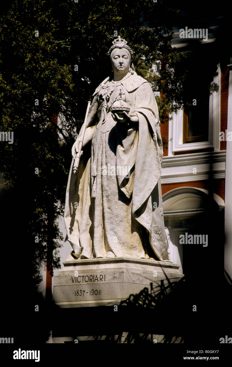 A colonial statue of Queen Victoria outside the Parliament building ...