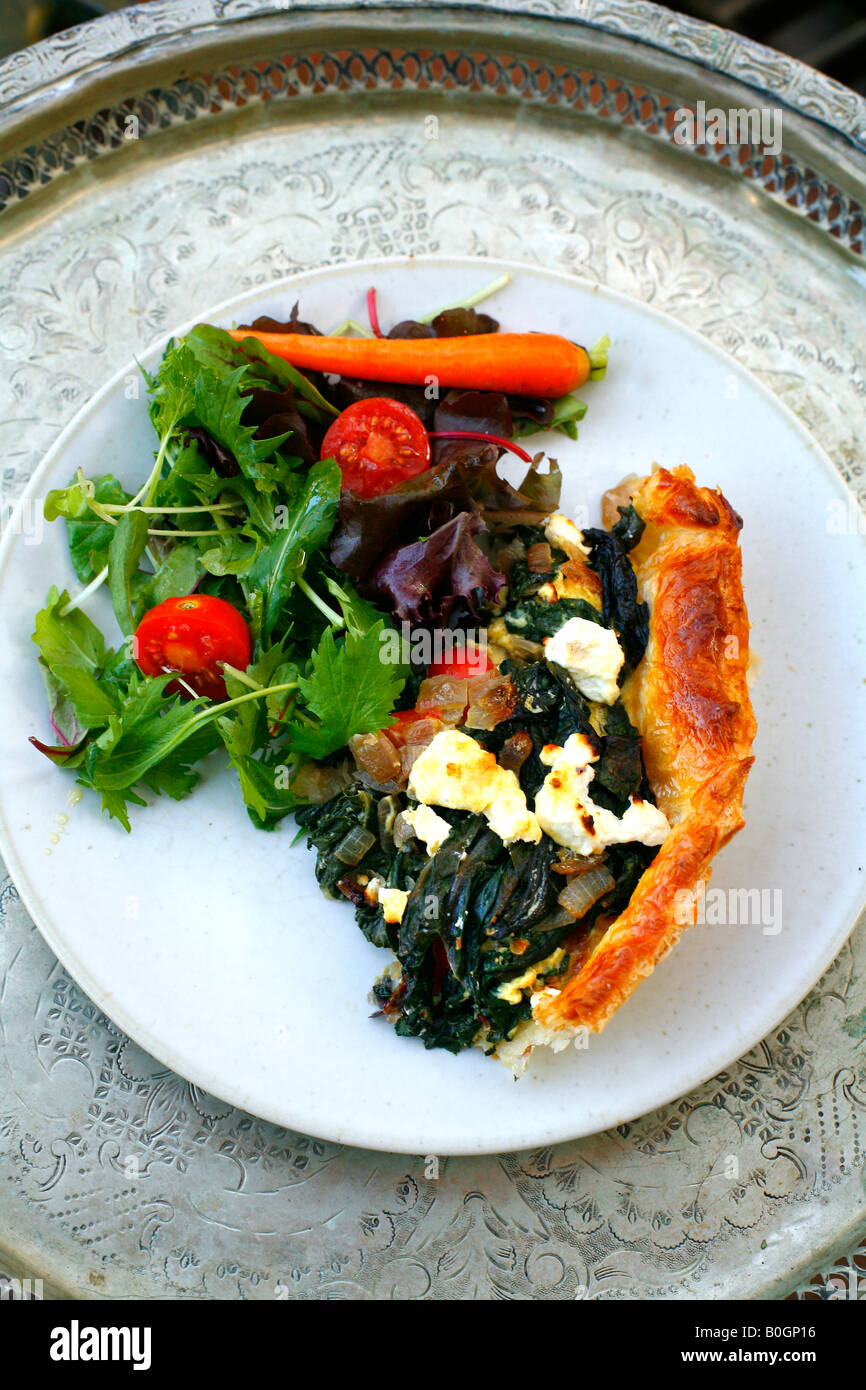 Spinach pie with goats cheese and red capsicum peppers Stock Photo - Alamy